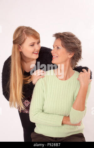 A beautiful plus size woman and her daughter share laughter and joy ...