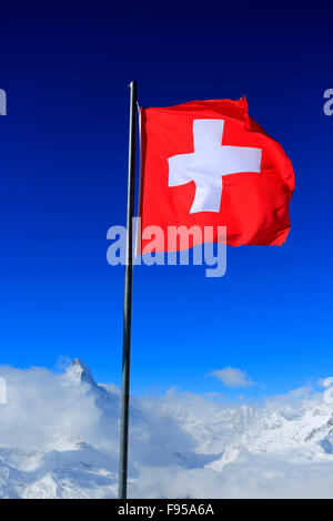 Flag of the Canton du Valais, and the Swiss national flag, Swiss Alps ...