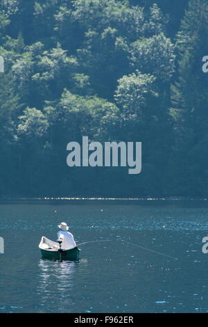 Man canoe fishing on Klein Lake near Egmont, , Sunshine Coast, British ...