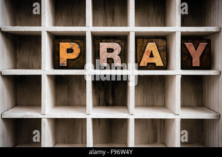 The word PRAY written in vintage lead letterpress type Stock Photo - Alamy