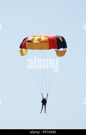 Multi coloured parachute over the blue sky Stock Photo - Alamy
