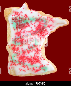 A holiday sugar cookie shaped like the US state of Minnesota with the ...