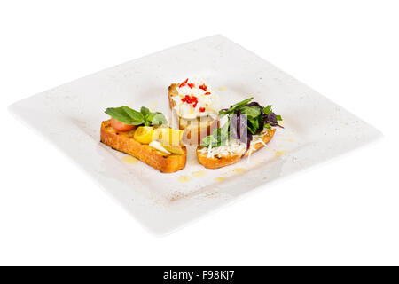 different colored Canapes on a white background Stock Photo - Alamy