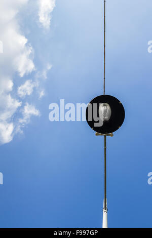 Electric cables seen from below with blue sky background Stock Photo ...