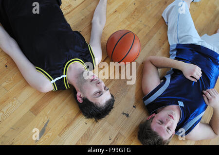 basketball players relax and rest after hard game Stock Photo - Alamy