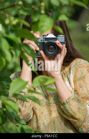 Girl with retro camera. Vintage Stock Photo - Alamy