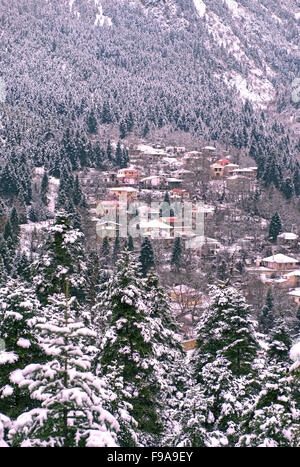A distant view of mountain forests covered with fog on a gloomy day ...