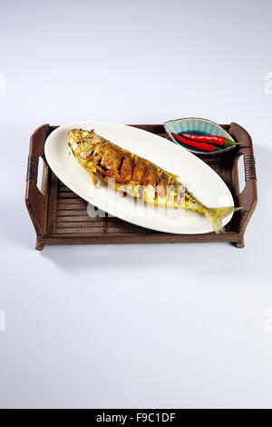 deep fried of fish marinated with turmeric powder Stock Photo - Alamy