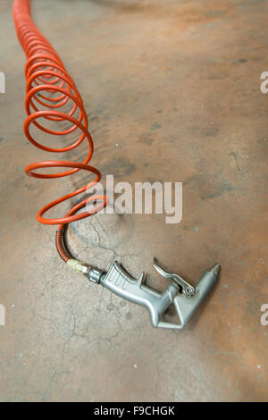 Air compressor gun with manometer isolated on a white background. Close ...