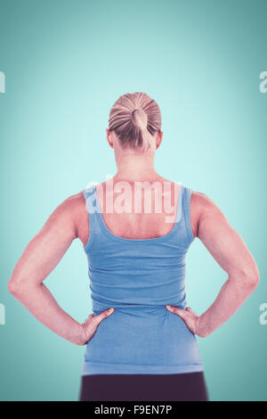 Composite image of back view of muscular woman Stock Photo - Alamy