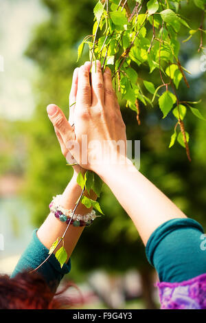 Human hands praying to god with shiny Jesus text over black background ...
