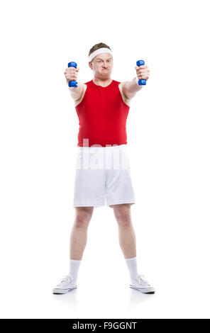 Funny weak man tries to lift a weight Stock Photo - Alamy