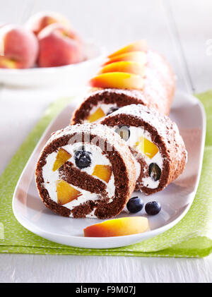 Peach and blueberry roulade Stock Photo - Alamy