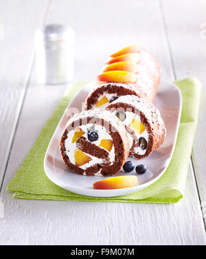 Peach and blueberry roulade Stock Photo - Alamy