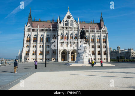 statue of Count Gyula Andrassy in front of Sunlit Hungarian Parliament ...