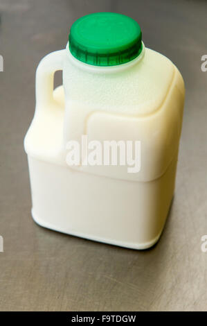 Small green top milk carton and mil Stock Photo - Alamy