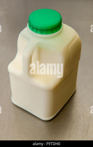 Small green top milk carton and milk Stock Photo - Alamy