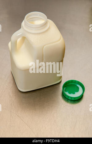 Small green top milk carton and milk Stock Photo - Alamy