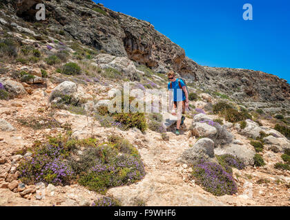 Malta, Ghar Lapsi, McCarthey's Cave, rock climber Stock Photo - Alamy