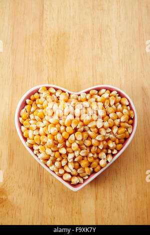 yellow daal in the heart shape container Stock Photo - Alamy