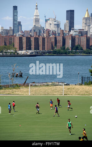 Soccer match in Bushwick Inlet Park in Williamsburg Brooklyn with East ...