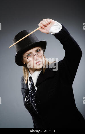 Harry Potter girl with magic stick against gray Stock Photo - Alamy