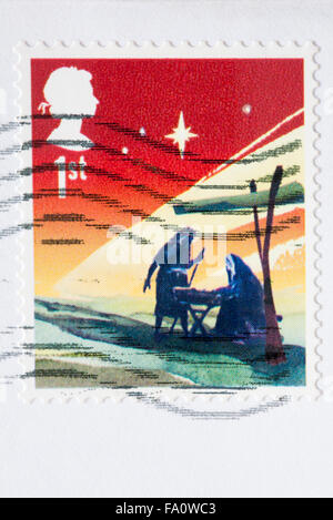 1st class Christmas stamp with nativity scene stuck on white envelope ...