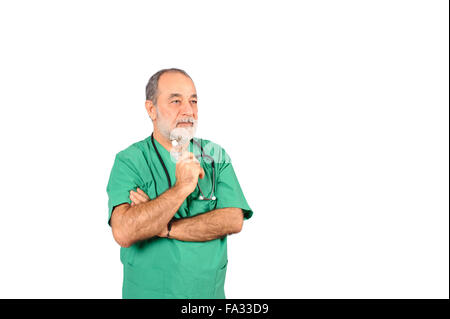 senior male surgery operator doctor with green uniform standing ...