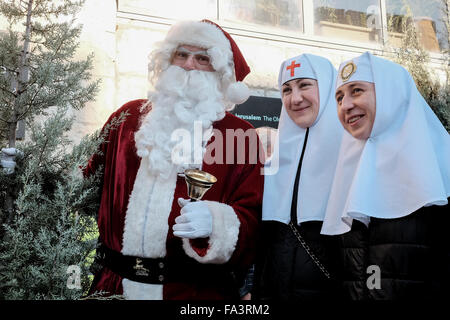 Jerusalem, Israel. 21st December, 2015. Issa, in a Santa Claus costume ...