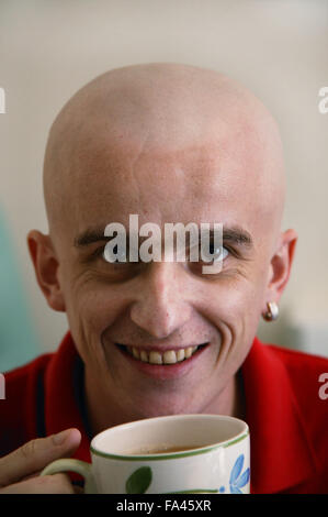 positive and hopeful hospital patient smiling before adversity - young ...