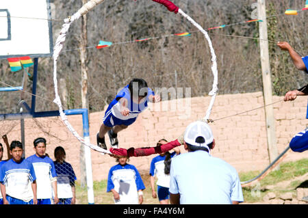 Bolivian youths jumping through rings of fire at the 500 year ...