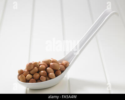 spoon full of ground nuts Stock Photo - Alamy