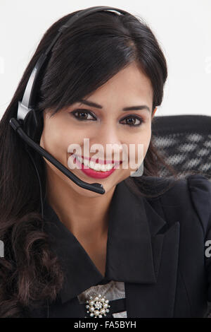 beatiful receptionist wearing head set talking Stock Photo - Alamy