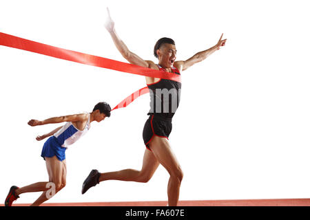 Track and field athletes to reach the finish line Stock Photo - Alamy