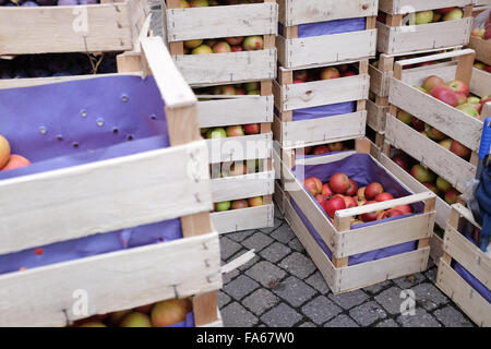Apples in apple crates with stack of wooden crates in background Stock ...
