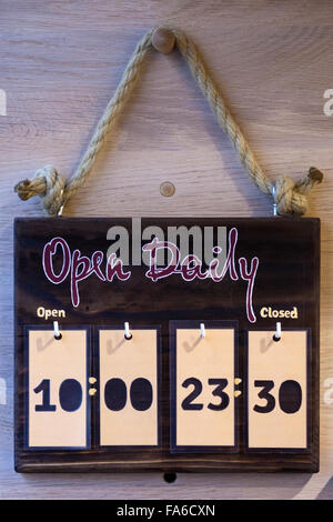 Open sign hanging on wall. Signboard OPEN of lightbox on white vintage ...