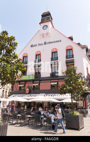 The town centre of Dieppe, Normandy, France, with pedestrians and cyclists. Cafe' des Tribunaux ...