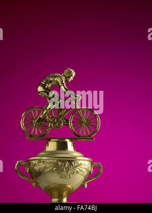 Trophy against the pink glass background Stock Photo - Alamy
