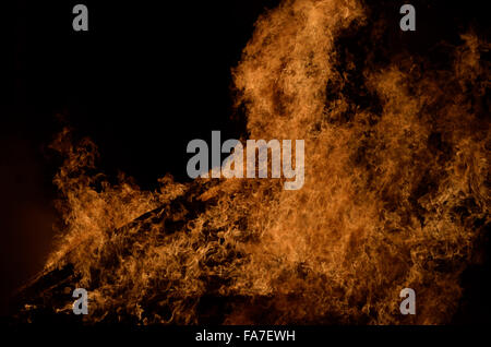 beautiful hot burning tall flames from bonfire on dark winter ...