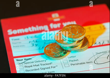 A Royal Mail delivery note posted through the door while the person was ...