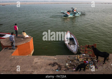 India - Varanasi - River Ganges - sewage pipe and laundryman Stock ...