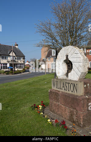 UK, England, Cheshire, Willaston, Village Green, sign with grindstone ...