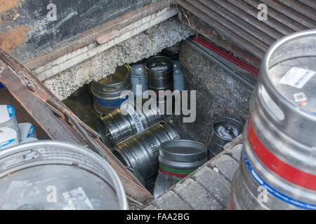Different types of metal beer kegs being distributed and stored in ...