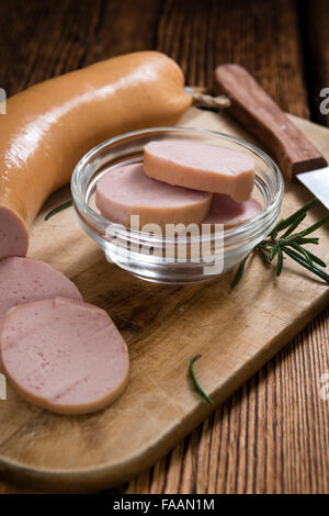 Portion of Baloney on rustic wooden background (close-up shot Stock ...