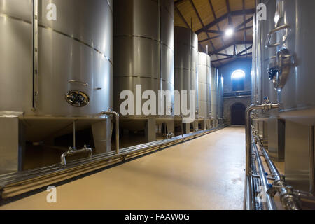 Rows of contemporary large stell barrels in winery factory Stock Photo ...