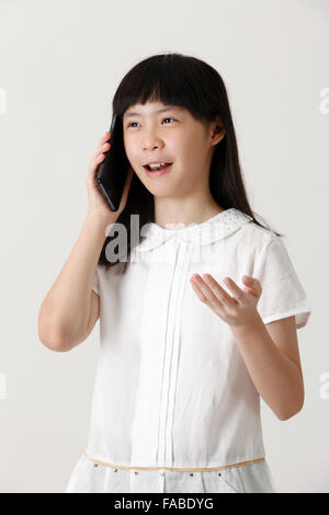 close up of the chinese girl talkingwith cellphone Stock Photo - Alamy