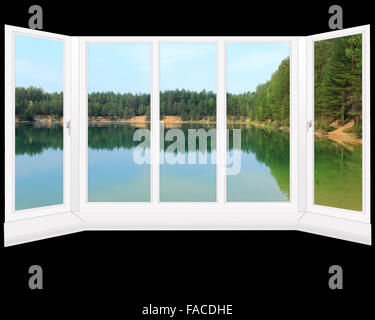Modern window overlooking green hill and trees Stock Photo - Alamy