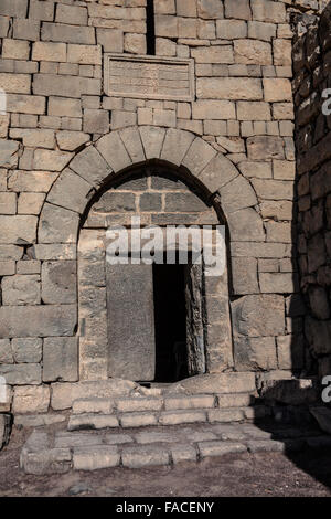 Stone door at Qasr al-Azraq, Blue Fortress, a large fortress located in ...