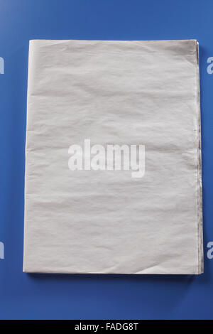 Blank nespaper on the blue background Stock Photo - Alamy