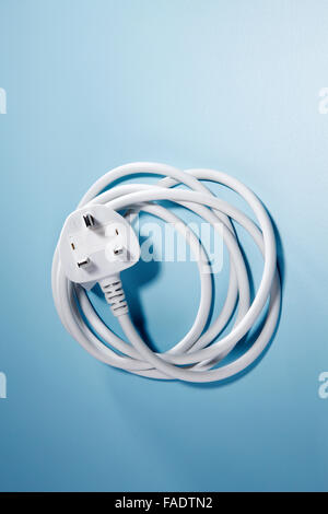 White electricity cable curled up like a cobra Stock Photo - Alamy